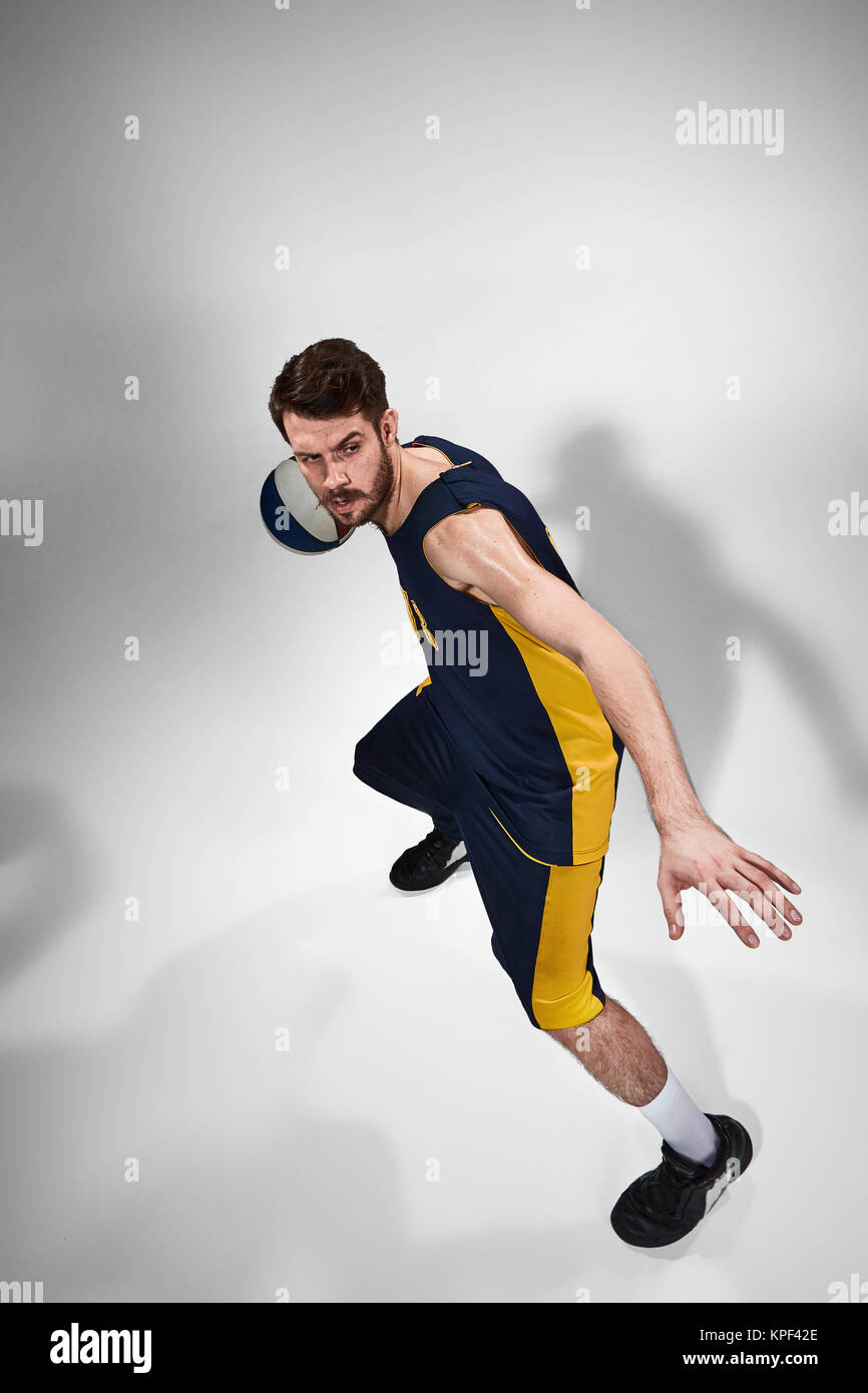 Full length portrait of a basketball player with ball Stock Photo - Alamy