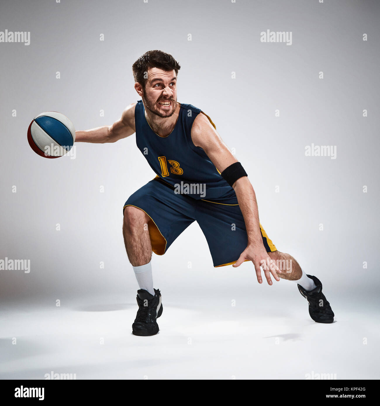 Full length portrait of a basketball player with ball Stock Photo - Alamy