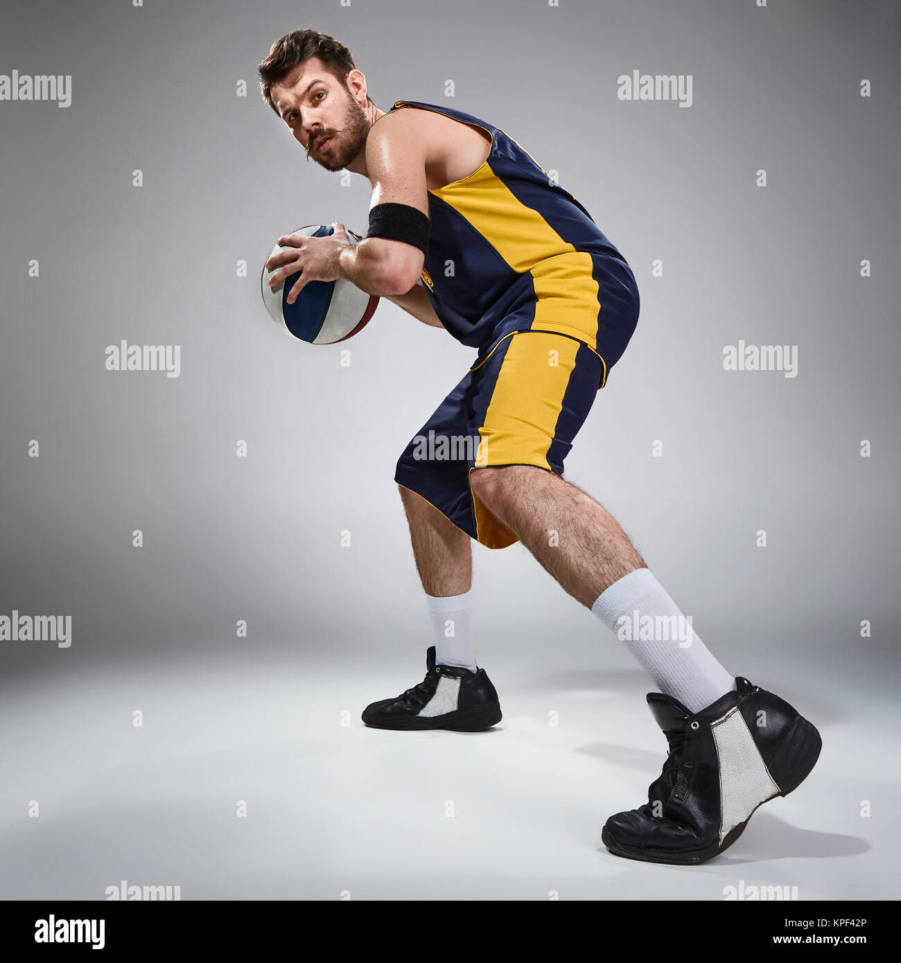 Full length portrait of a basketball player with ball Stock Photo - Alamy