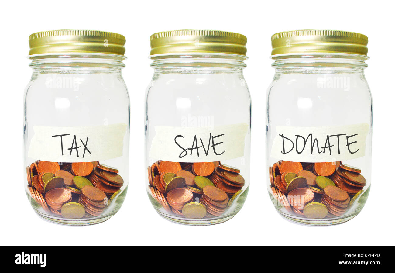 coins in bottle with Tax Saving Donate plan label on white background ...