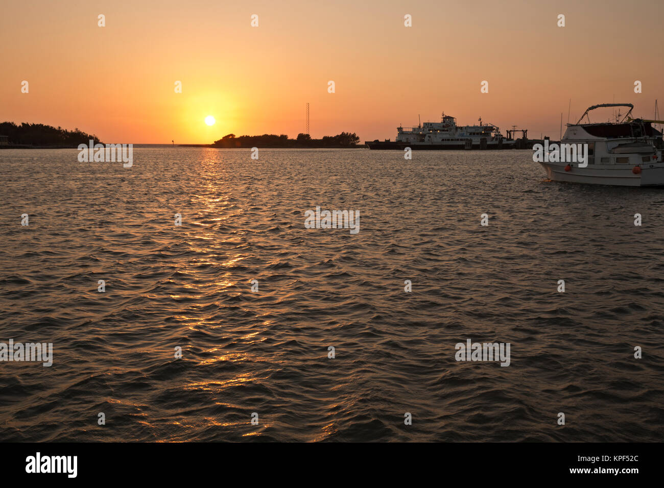 NC01065-00...NORTH CAROLINA - Silver Lake Harbor at sunset in the town ...