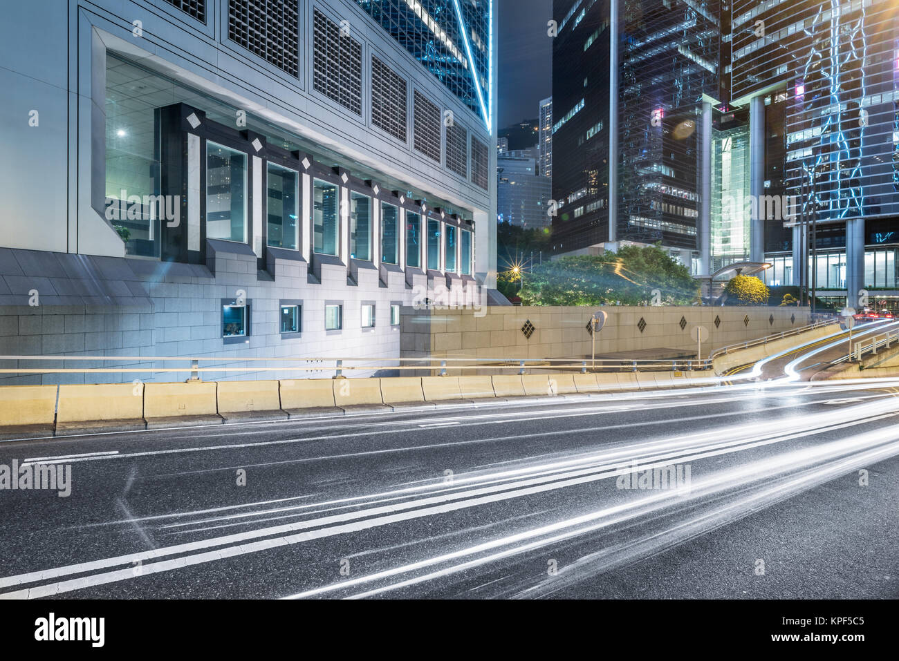 light trails on city street with cityscape at night in China Stock ...