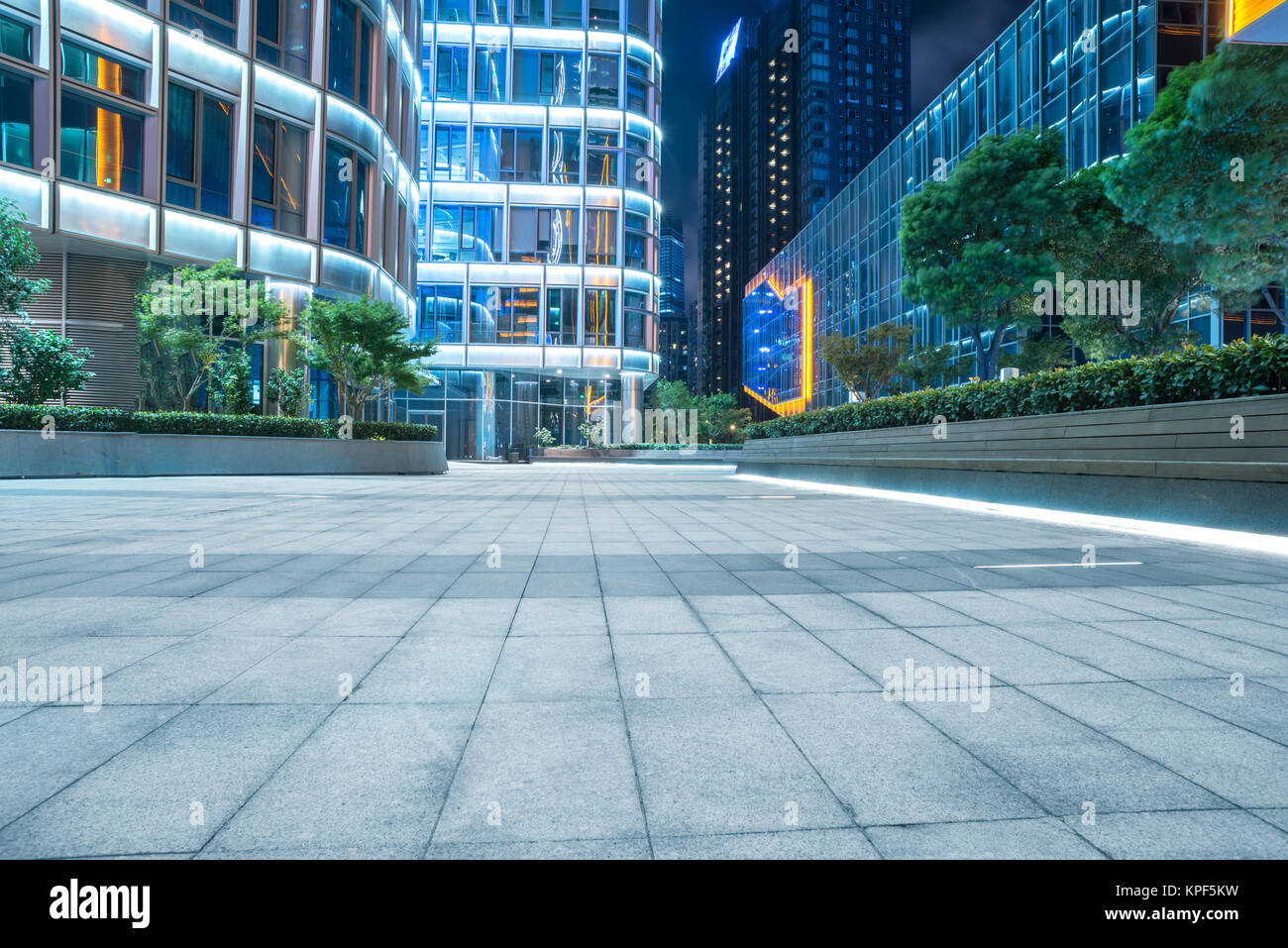 empty brick floor with modern building in background Stock Photo - Alamy