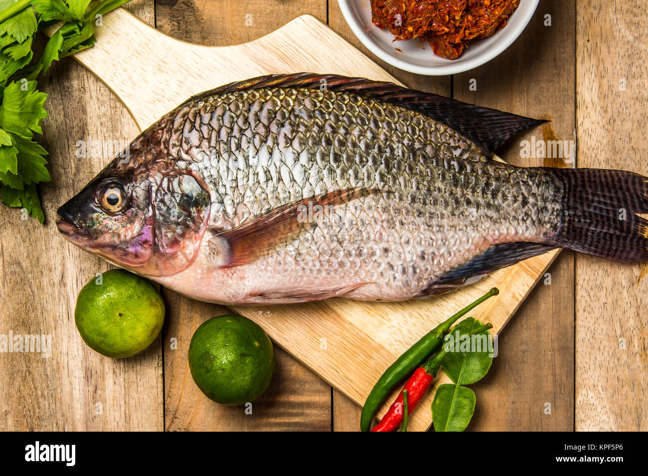 Fresh raw fish on the wood Stock Photo - Alamy