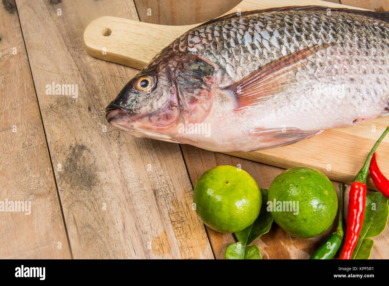 Fresh raw fish on the wood Stock Photo - Alamy