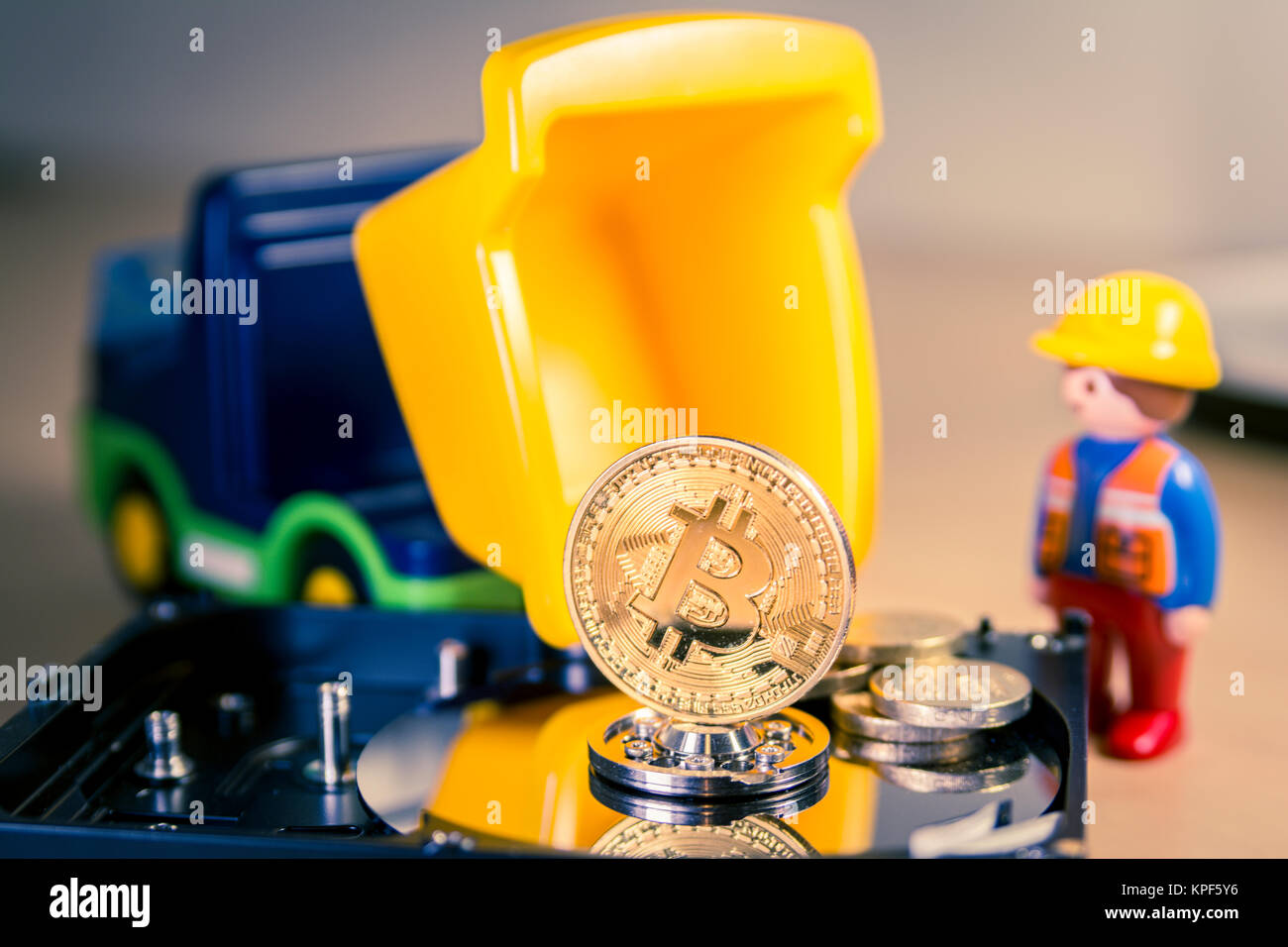 Golden Bitcoin carry or loading on a Truck over a hard disk and a ...