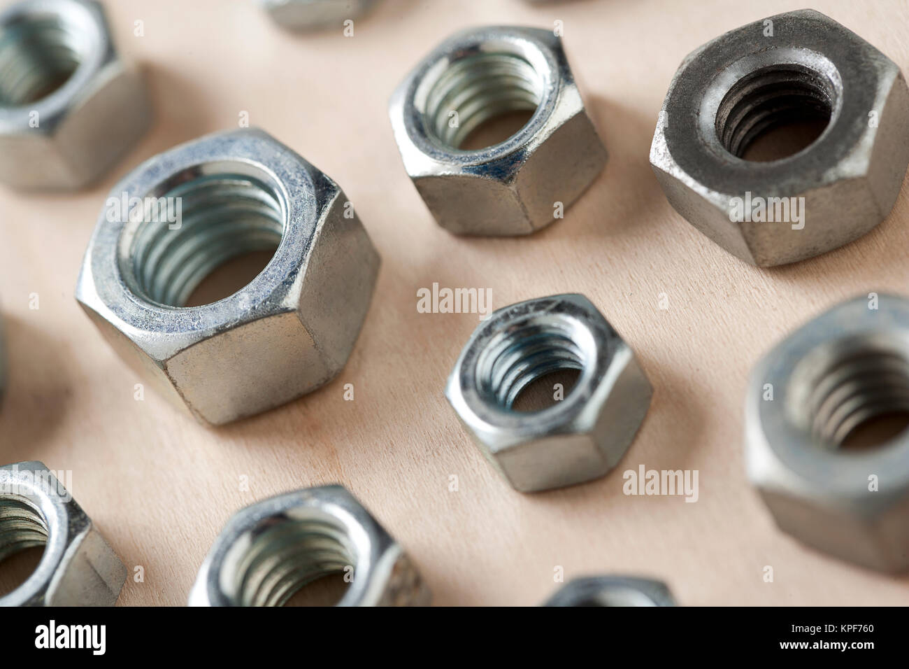 different sizes metal nuts Stock Photo - Alamy