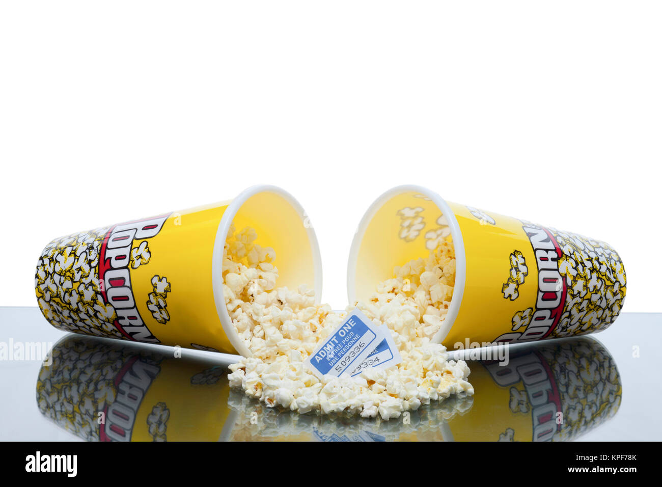 scattered popcorn from bucket with movie ticket Stock Photo - Alamy