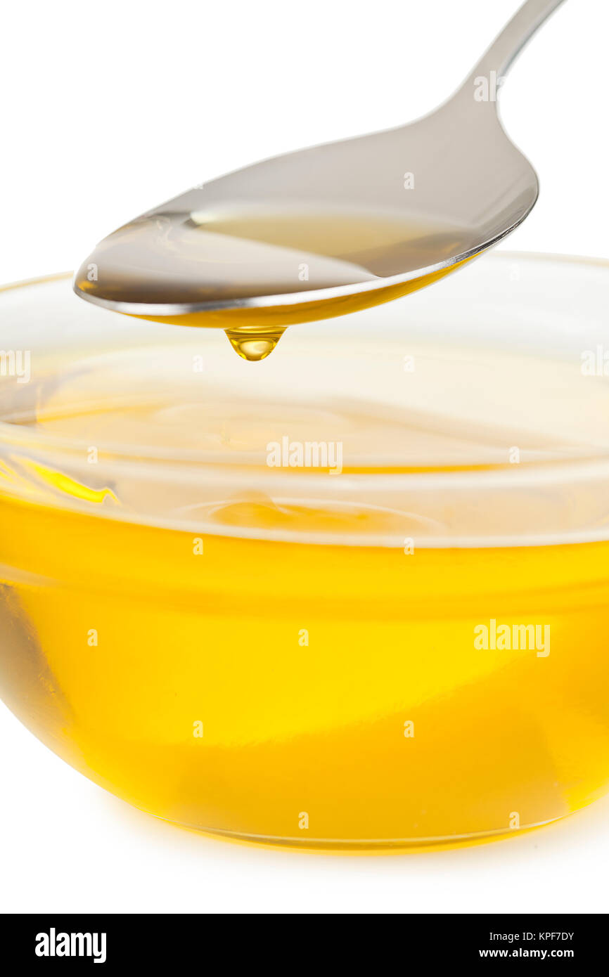 spoon and bowl of oil Stock Photo - Alamy