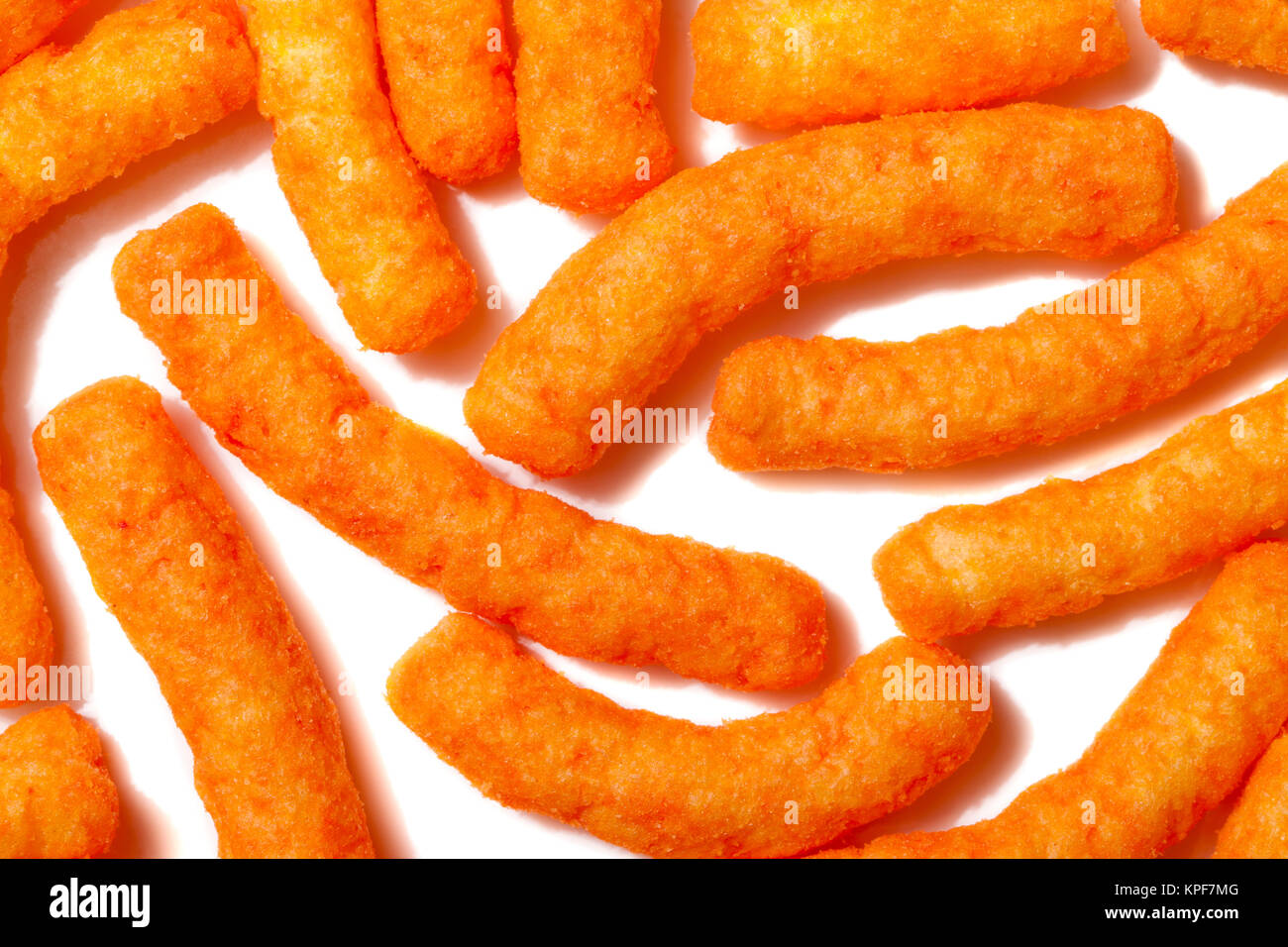 scattered cheese puffs Stock Photo - Alamy