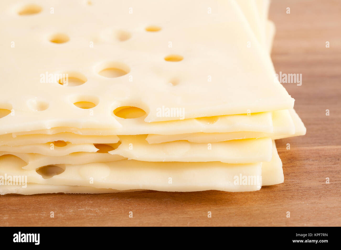 slices of swiss cheese Stock Photo - Alamy