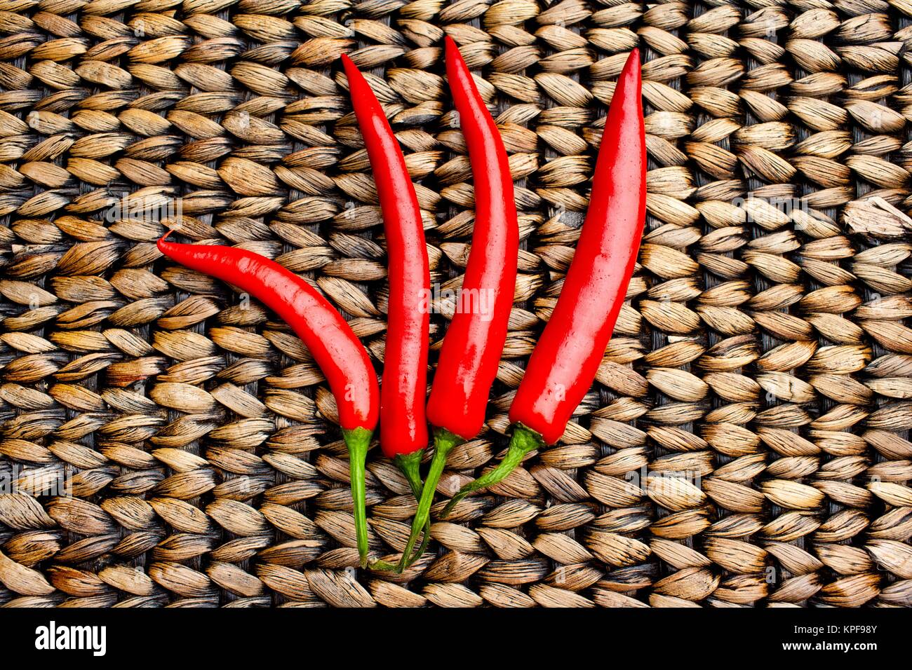 Four Red Chilli Peppers Stock Photo - Alamy