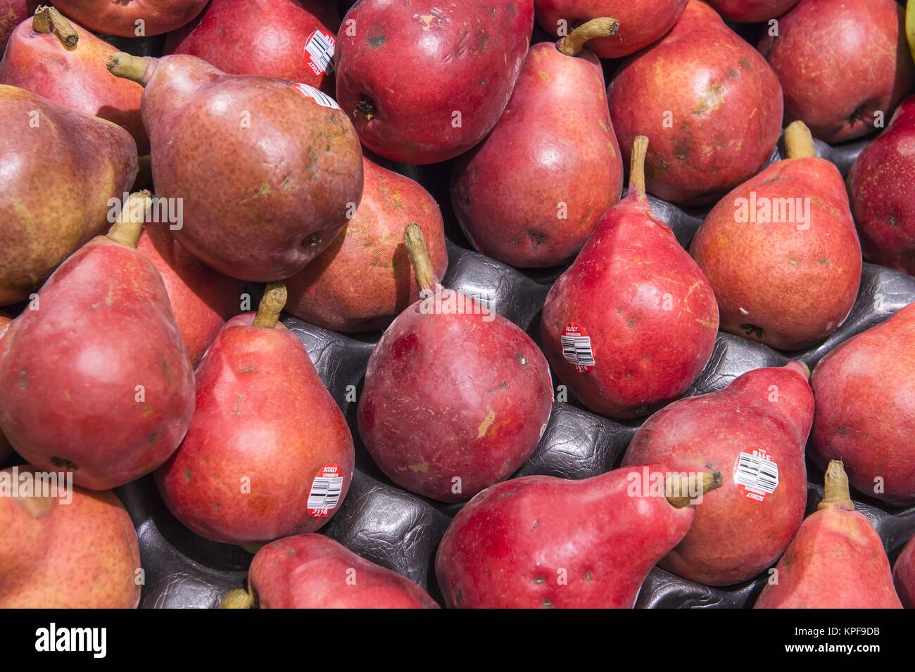 fresh red pears from market shelves real with flaws and bruises Stock ...