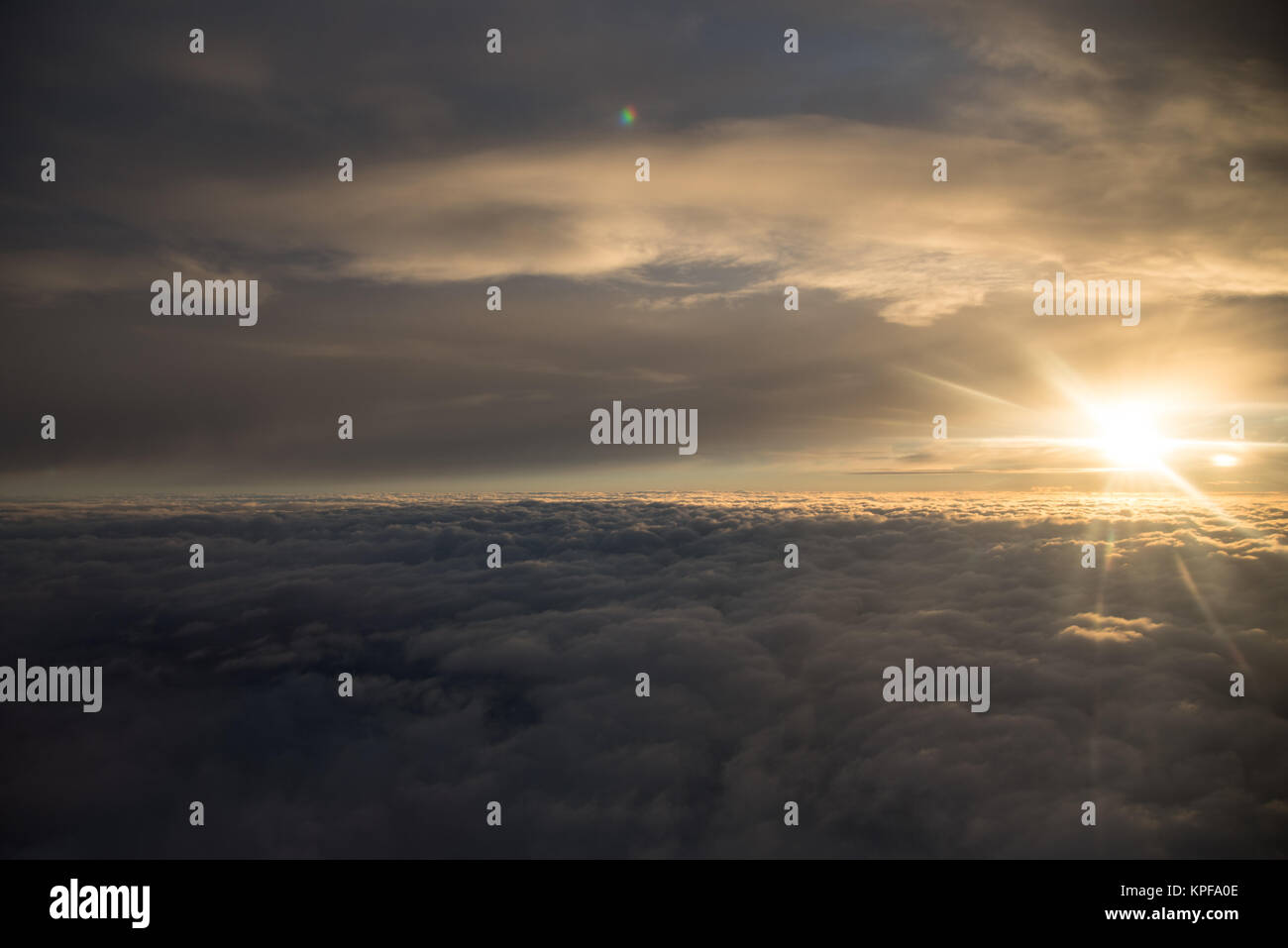 Sun over the clouds during a flight Stock Photo - Alamy