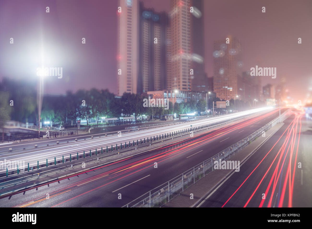 blurred traffic light trails on road in Beijing,China Stock Photo - Alamy