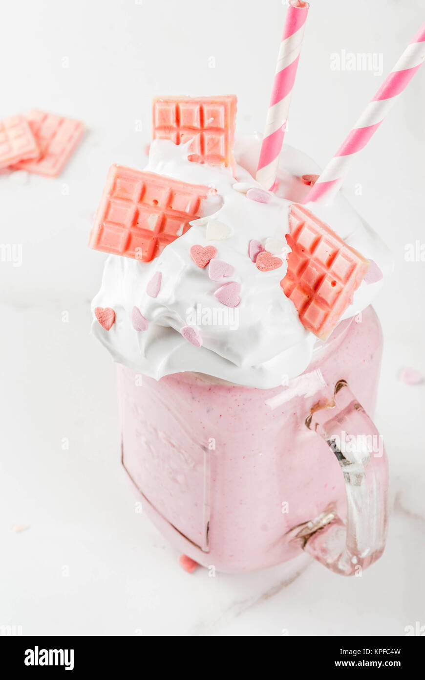 Glass pink milkshake decorated candy hi-res stock photography and ...