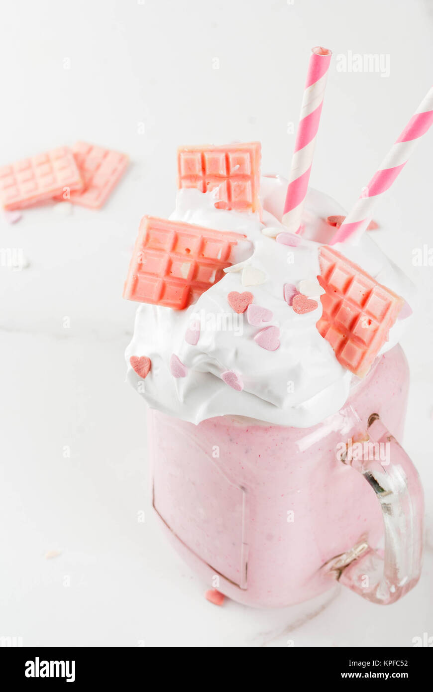 Glass pink milkshake decorated candy hi-res stock photography and ...