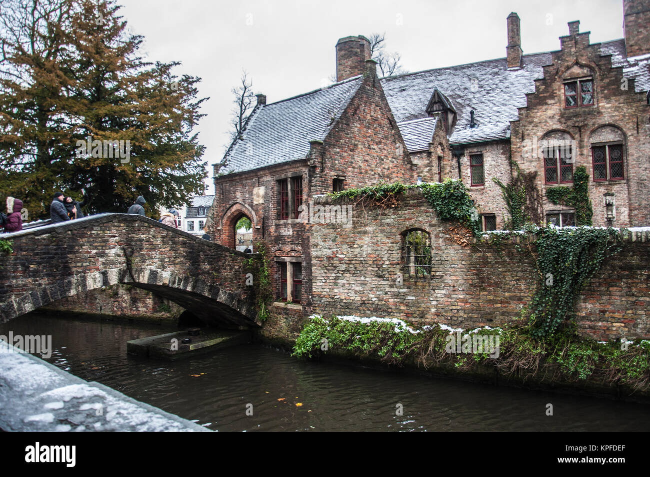 bridge, canal and architecture in brugge, snowing day, snow, bruges ...