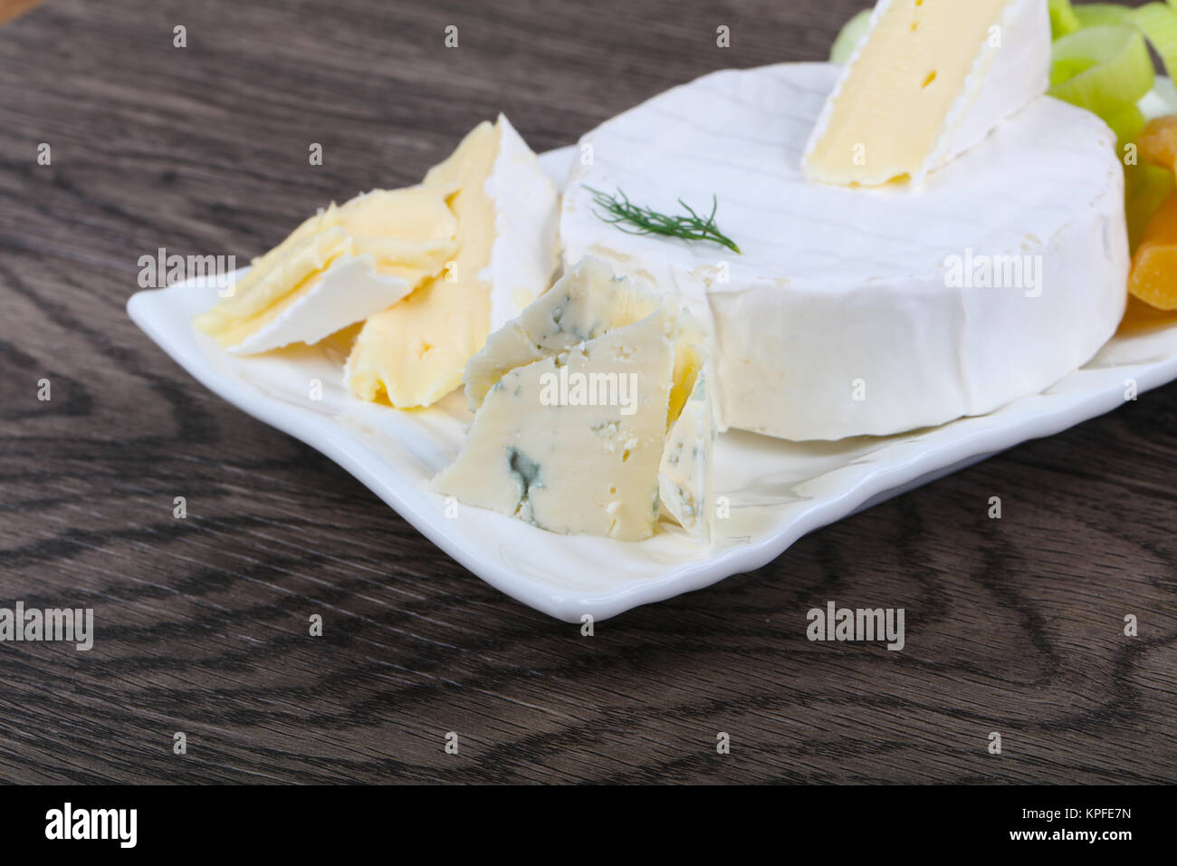 Cheese platter with brie, blue and parmesan Stock Photo - Alamy