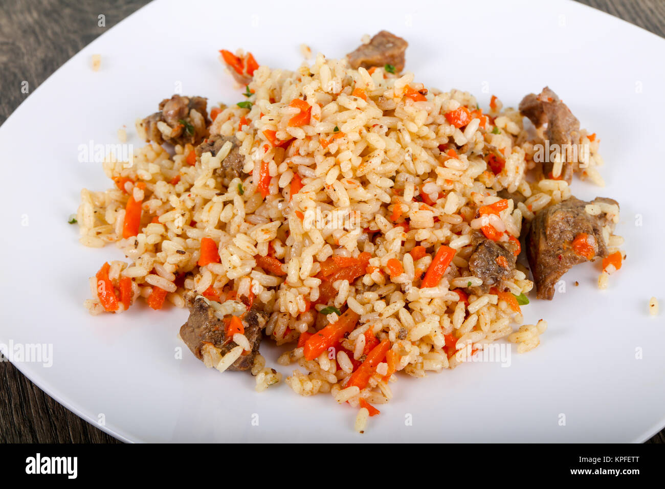 Asian rice - Plov with meat and carrot Stock Photo - Alamy