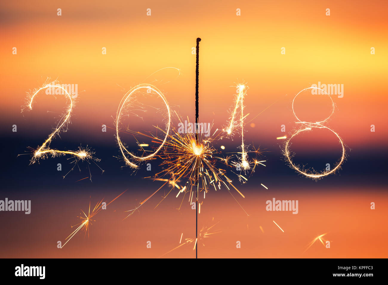 2018 written with Sparkle firework on sunset background, happy new year ...