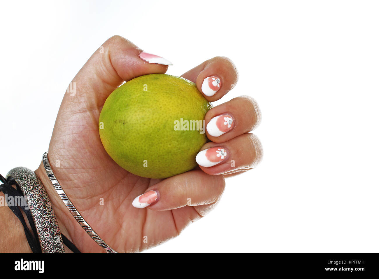 Woman hand holding lime lemon on isolated white cutout background ...