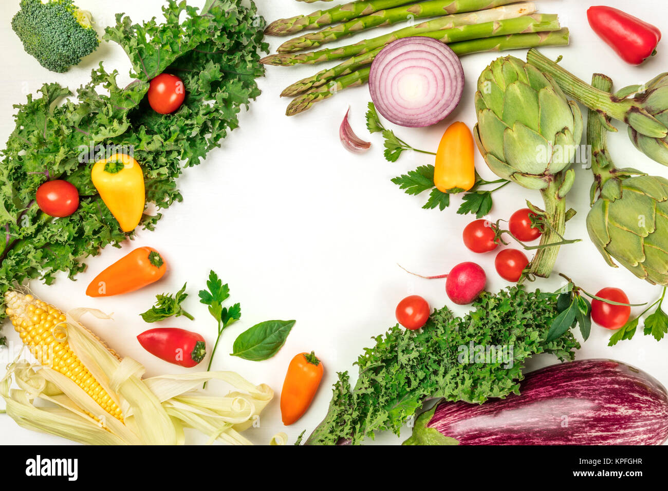 An overhead photo of fresh vegetables forming a frame, shot from above ...