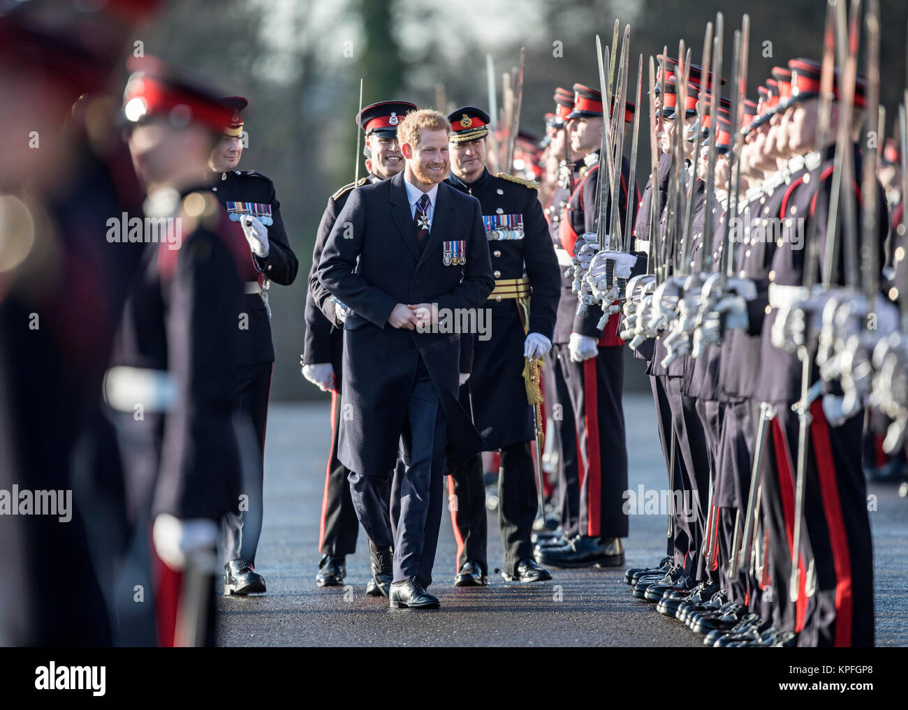 Prince Harry insects the graduating officer cadets at the Royal ...