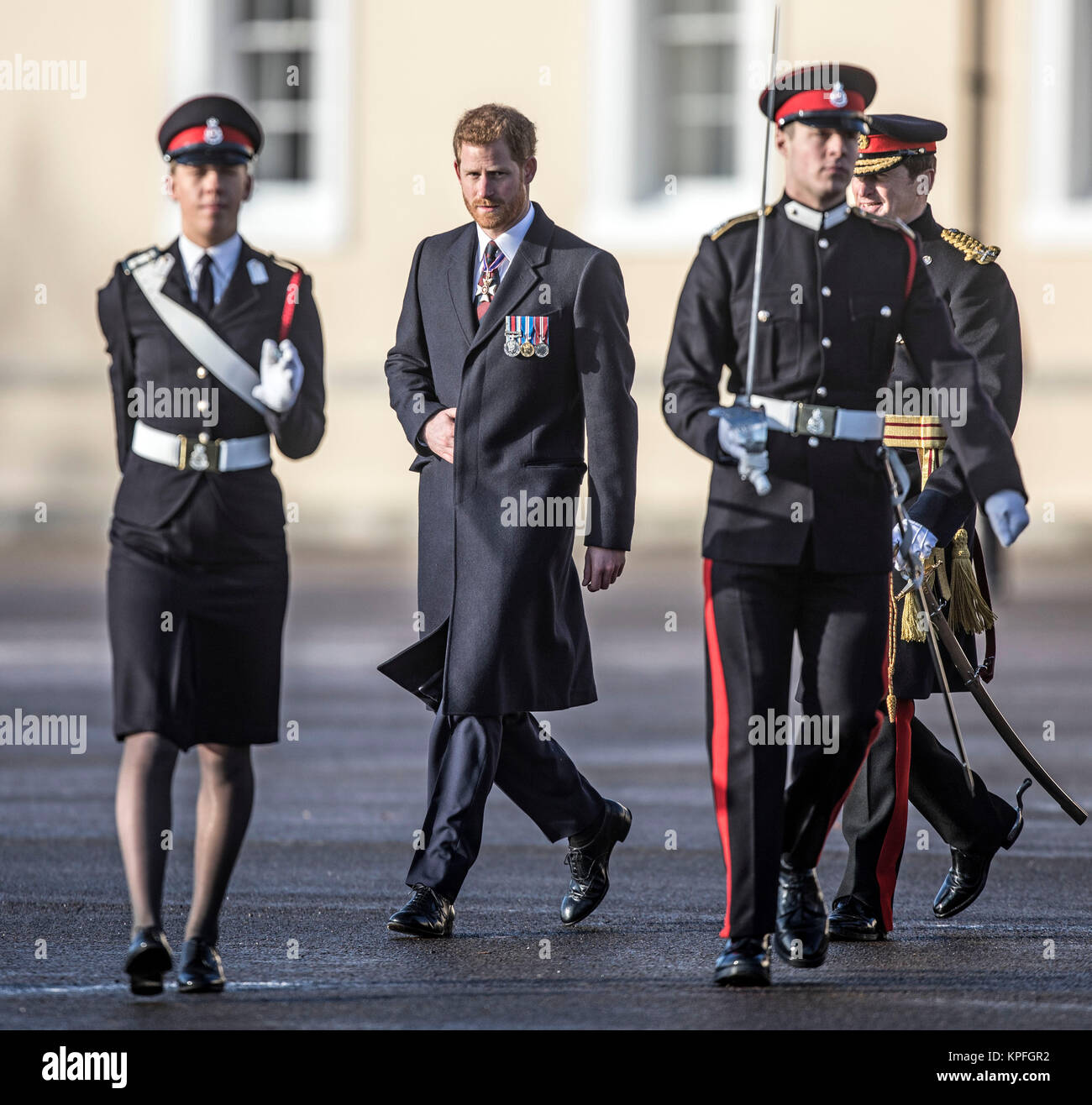 Prince Harry insects the graduating officer cadets at the Royal ...