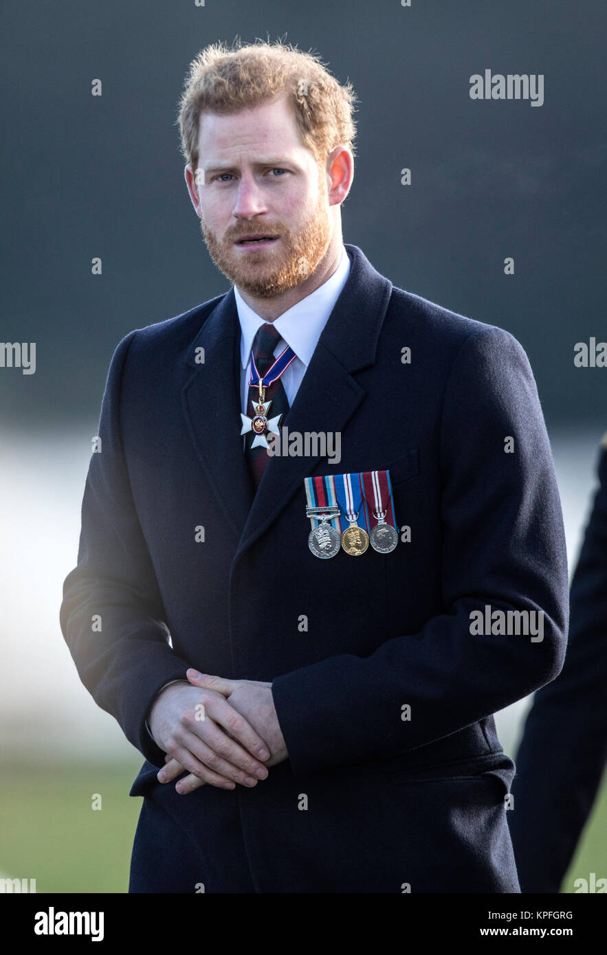 Prince Harry insects the graduating officer cadets at the Royal ...