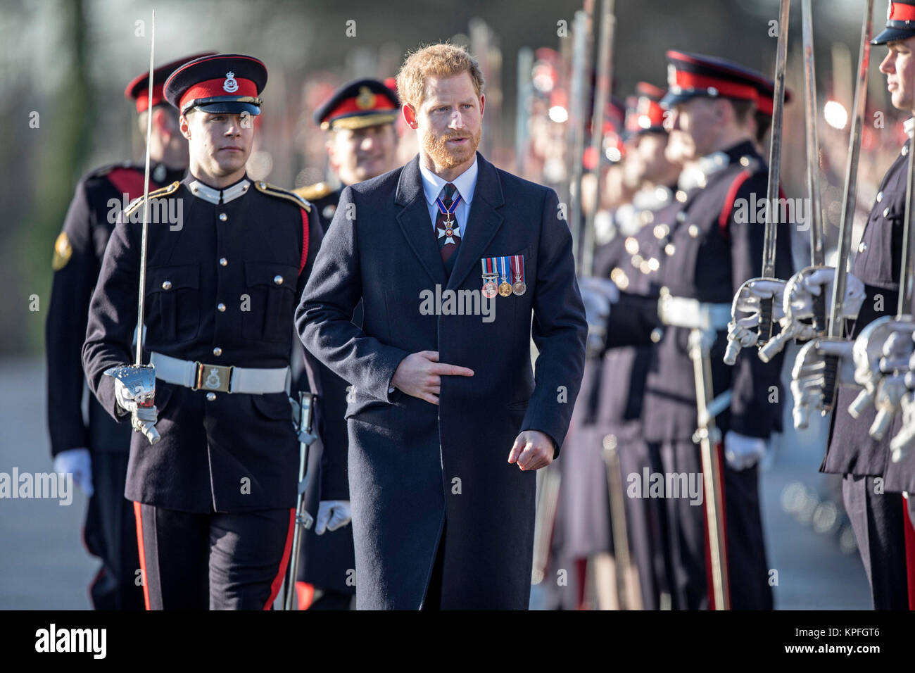 Prince Harry insects the graduating officer cadets at the Royal ...