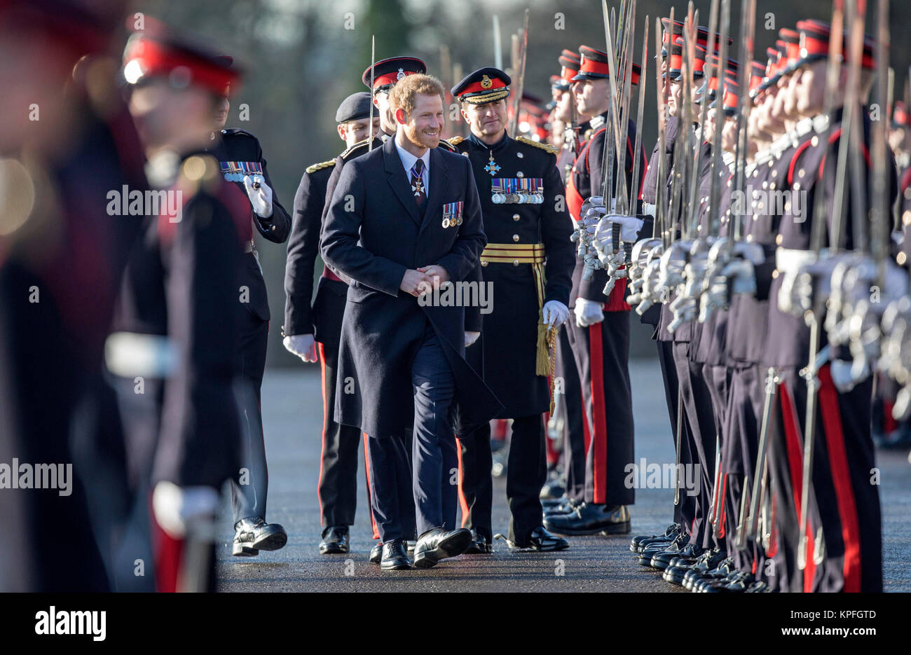 Prince Harry insects the graduating officer cadets at the Royal ...