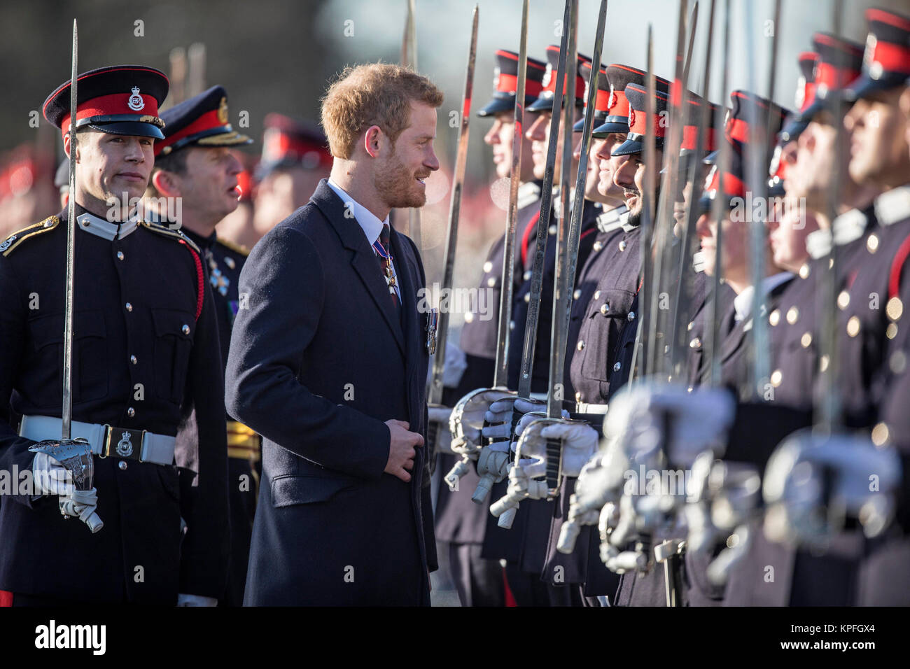 Prince Harry insects the graduating officer cadets at the Royal ...