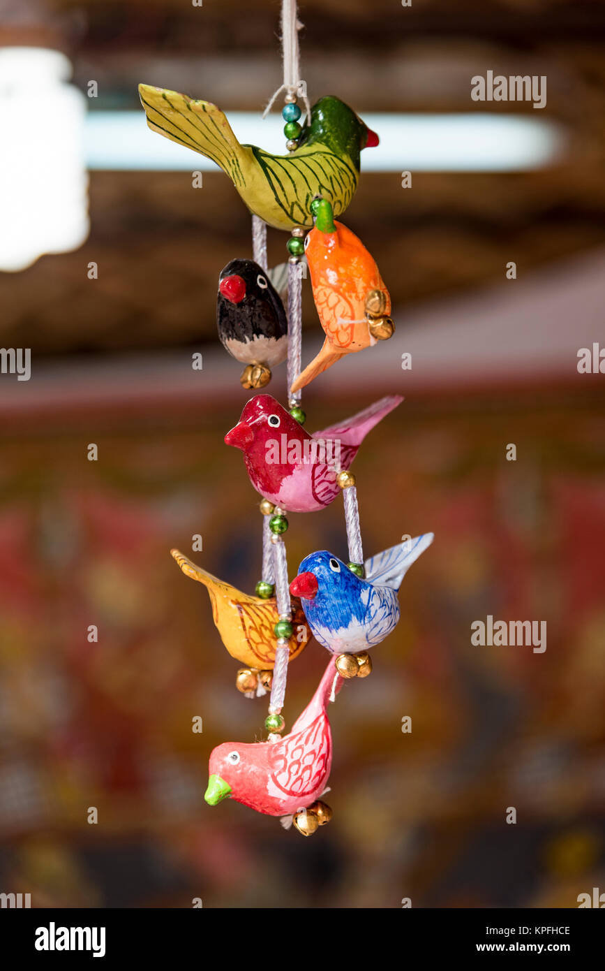 Beautiful hand crafted colourful artefacts for decoration kept in a ...