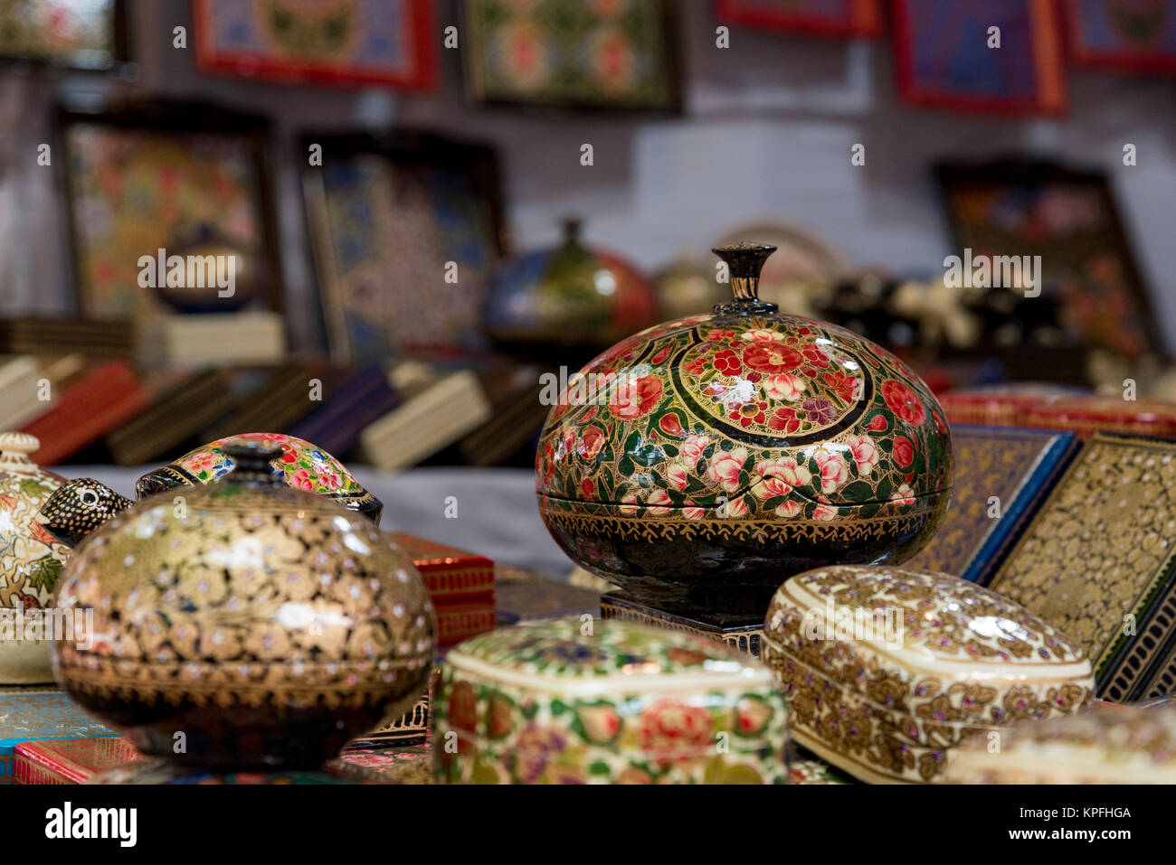 Beautiful hand crafted colourful artefacts for decoration kept in a ...