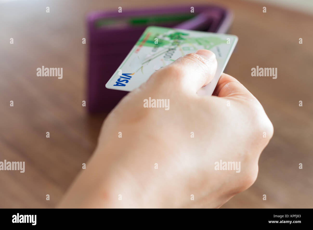 Visa cards on wooden table Stock Photo - Alamy