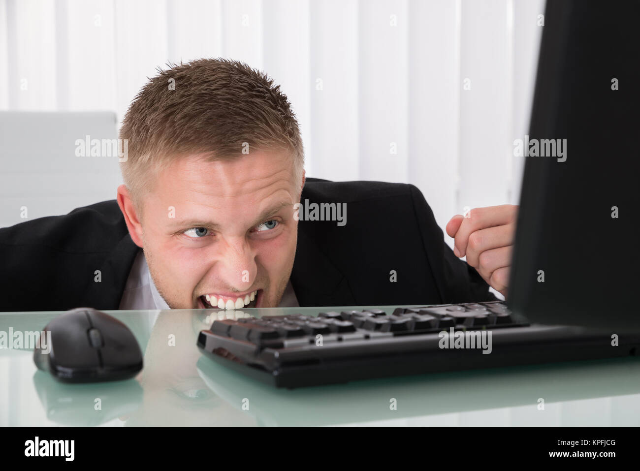 Angry Businessman Looking At Computer Stock Photo - Alamy