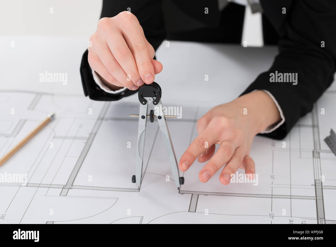 Female Architect Hands Holding Compass On Blueprint Stock Photo - Alamy