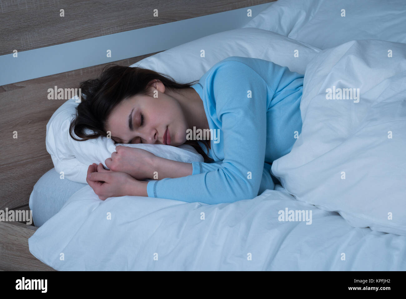 Woman Sleeping On Bed Stock Photo - Alamy