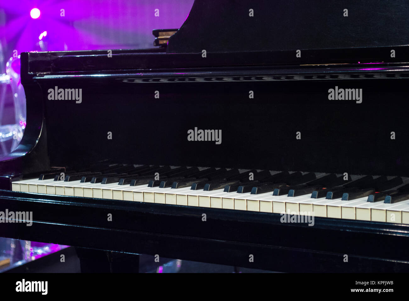 piano with lights in background Stock Photo - Alamy