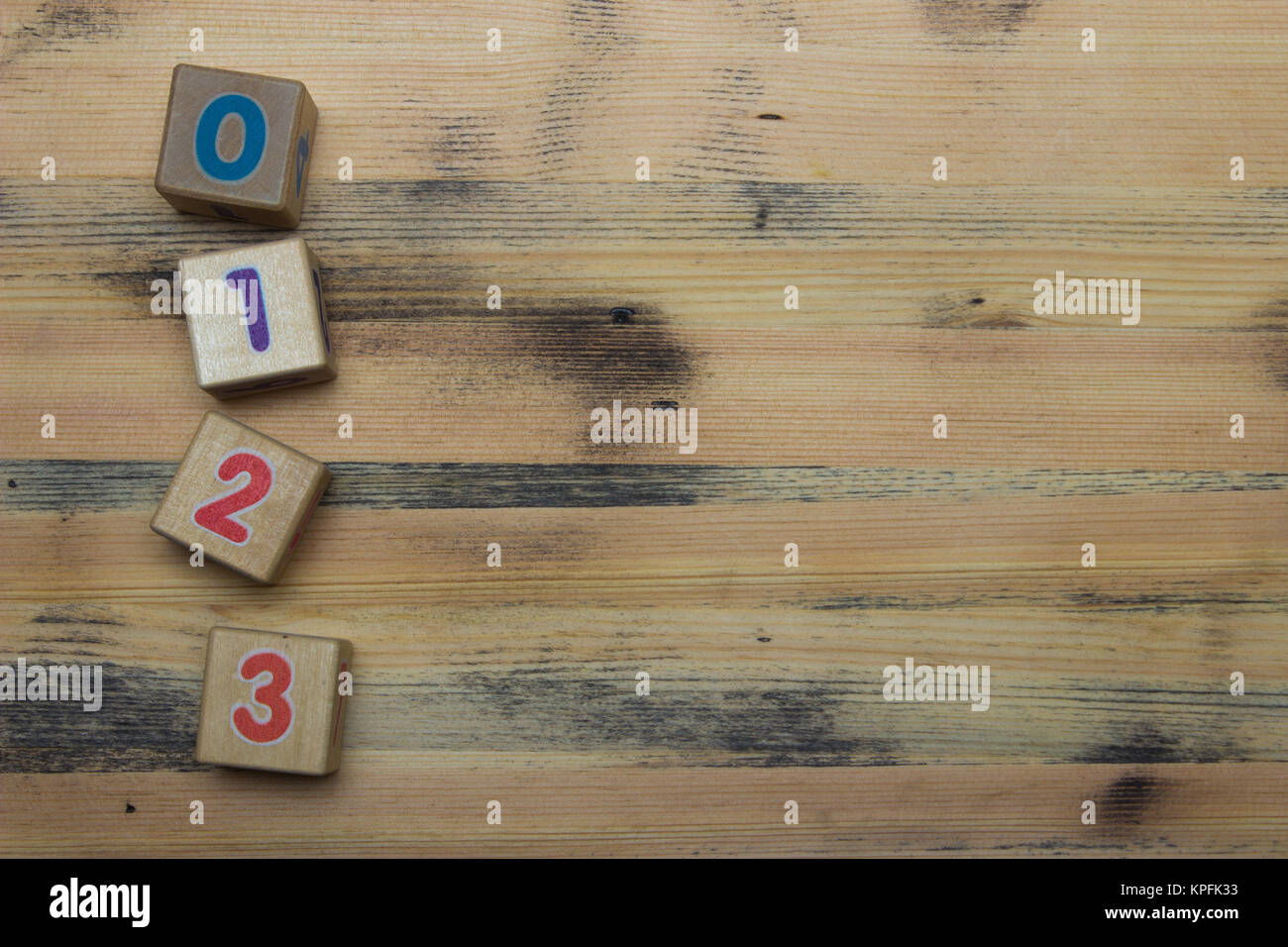Cubes with numbers on wooden background Stock Photo - Alamy