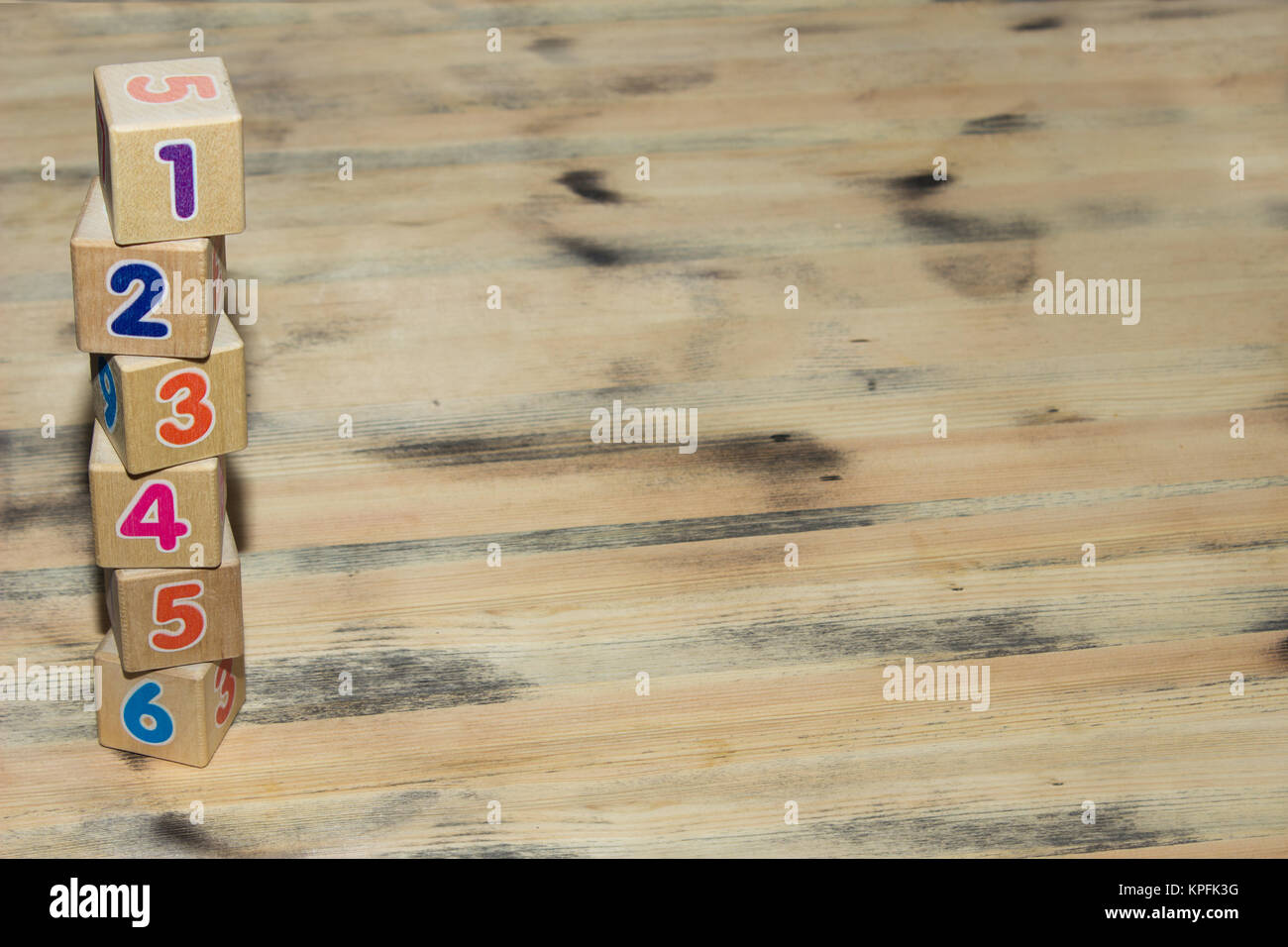 Cubes with numbers on wooden background Stock Photo - Alamy