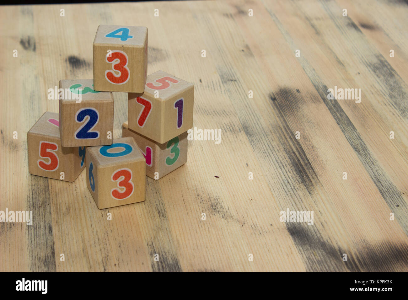 Cubes with numbers on wooden background Stock Photo - Alamy
