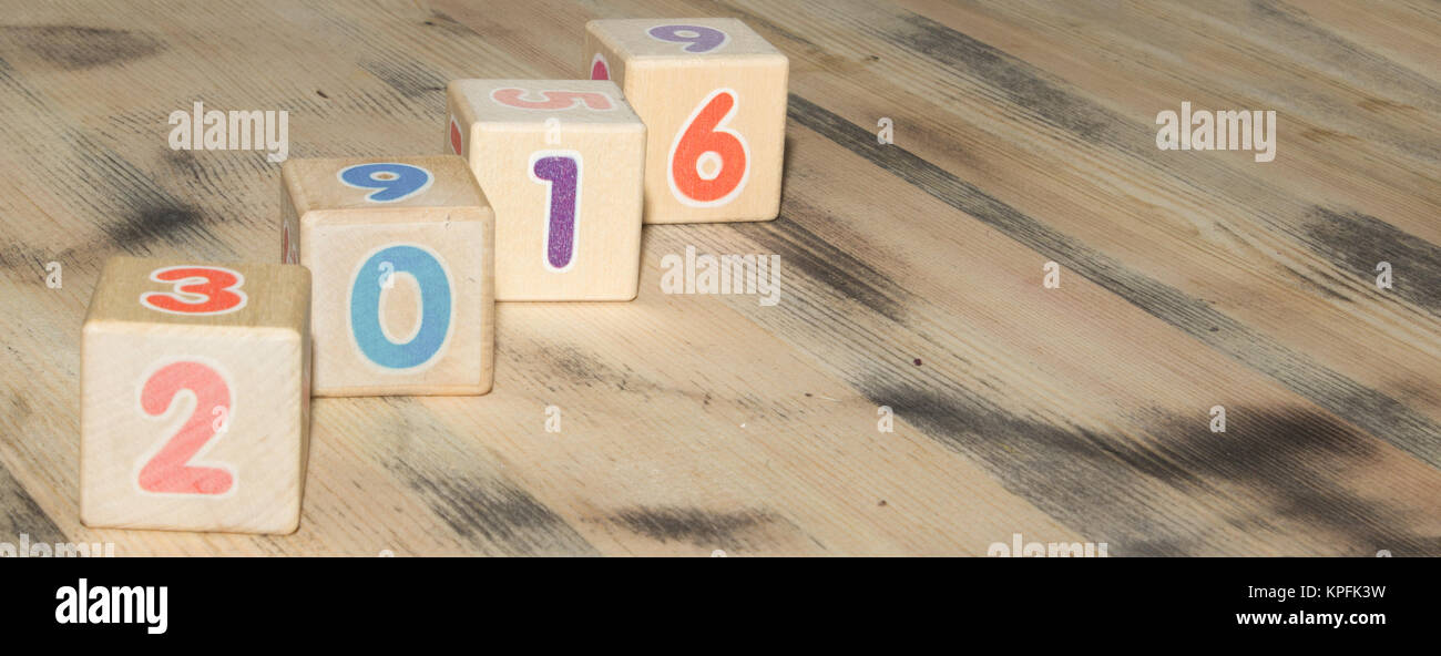 Cubes with numbers on wooden background Stock Photo - Alamy
