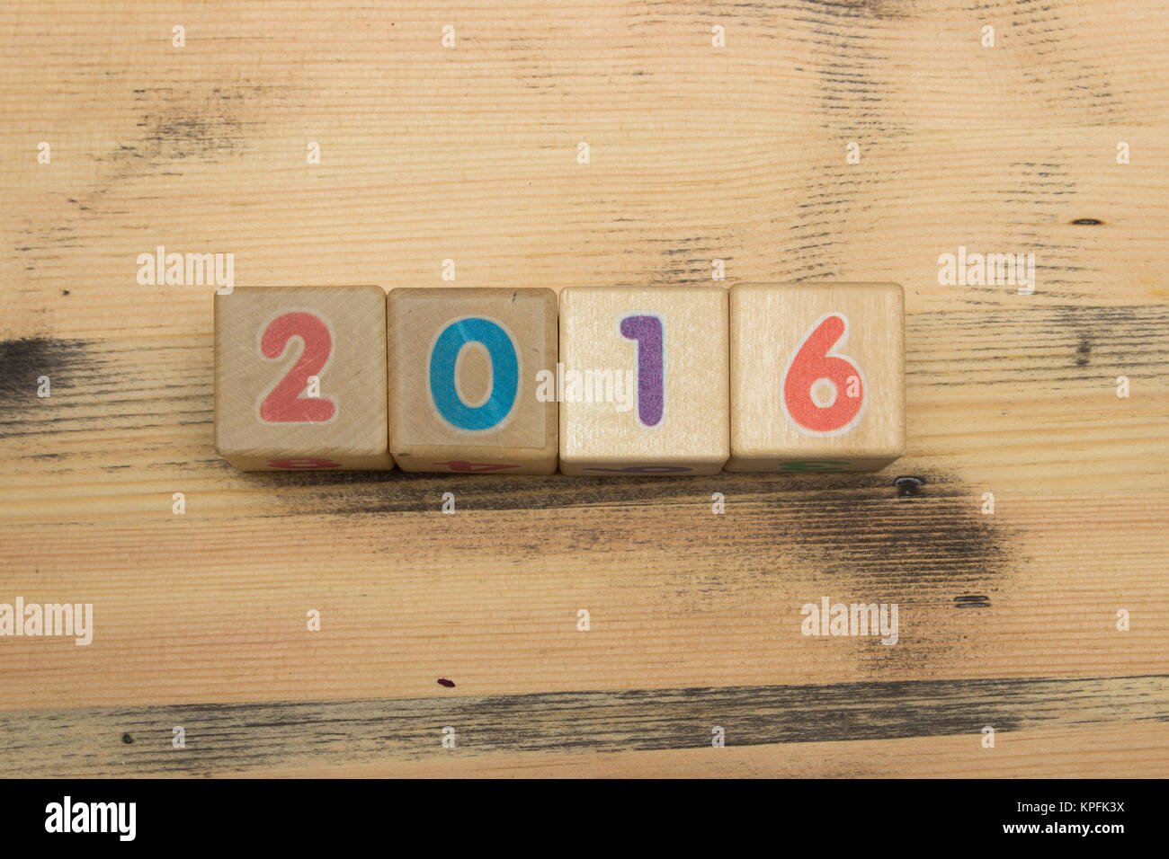 Cubes with numbers on wooden background Stock Photo - Alamy