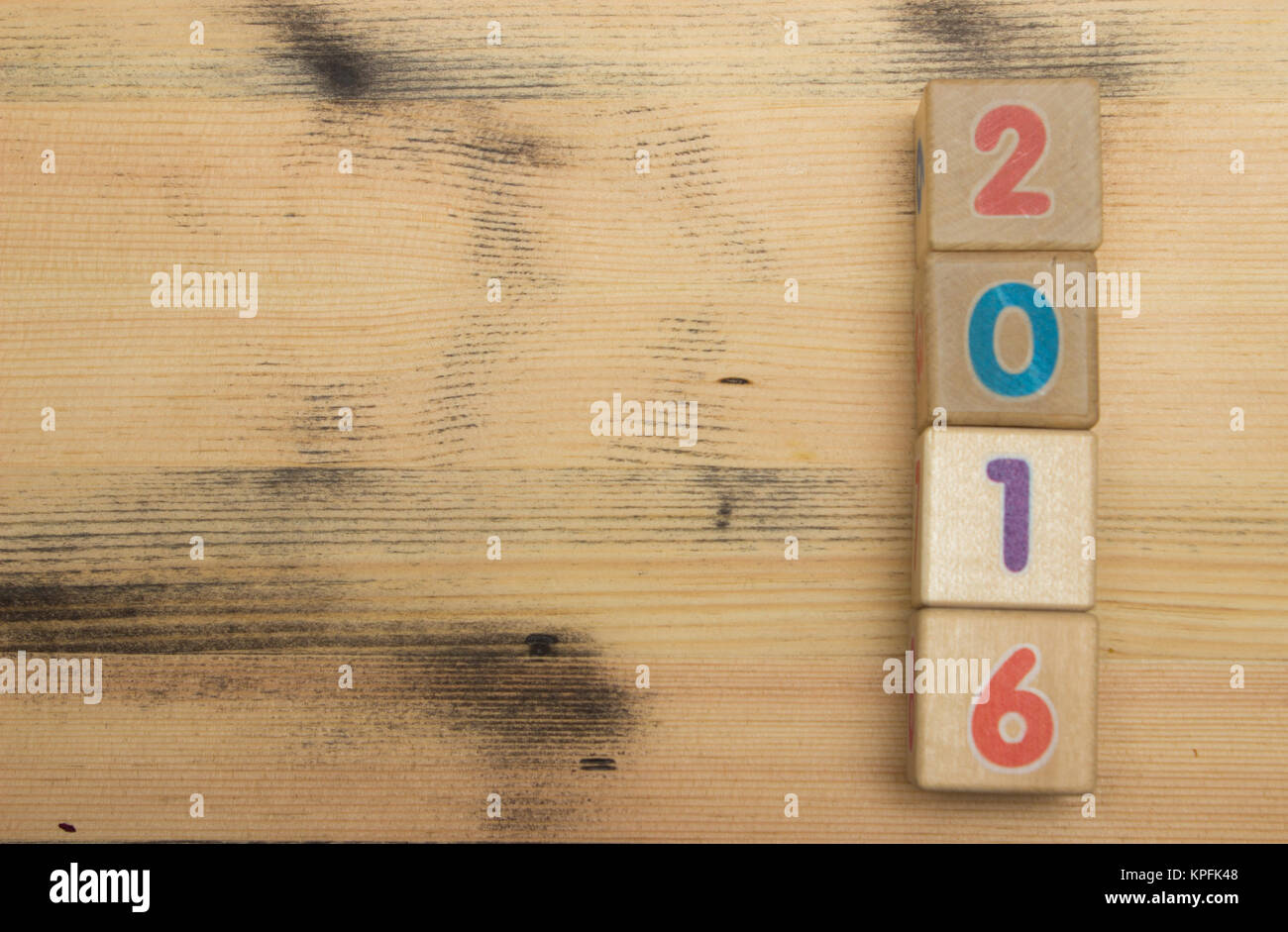 Cubes with numbers on wooden background Stock Photo - Alamy