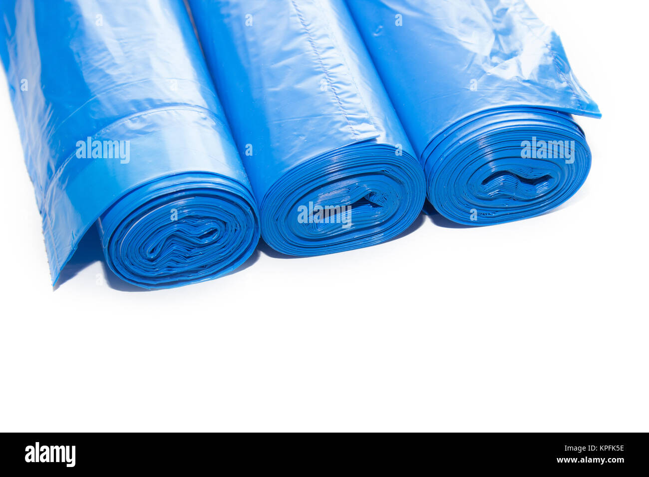 Roll of blue plastic garbage bags isolated on white Stock Photo - Alamy