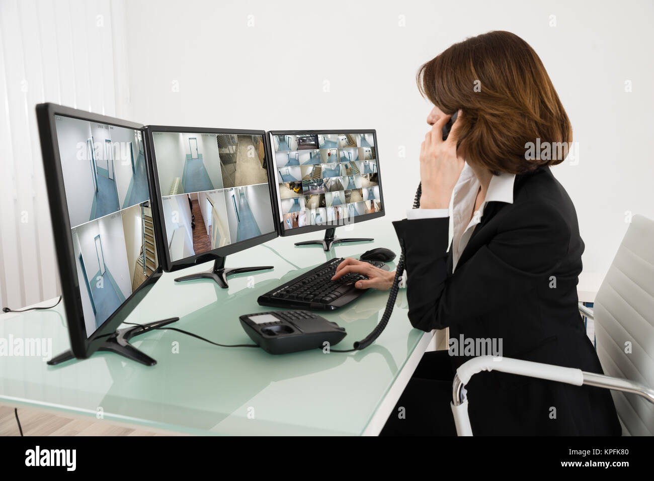 Female operator looking multiple camera hi-res stock photography and ...