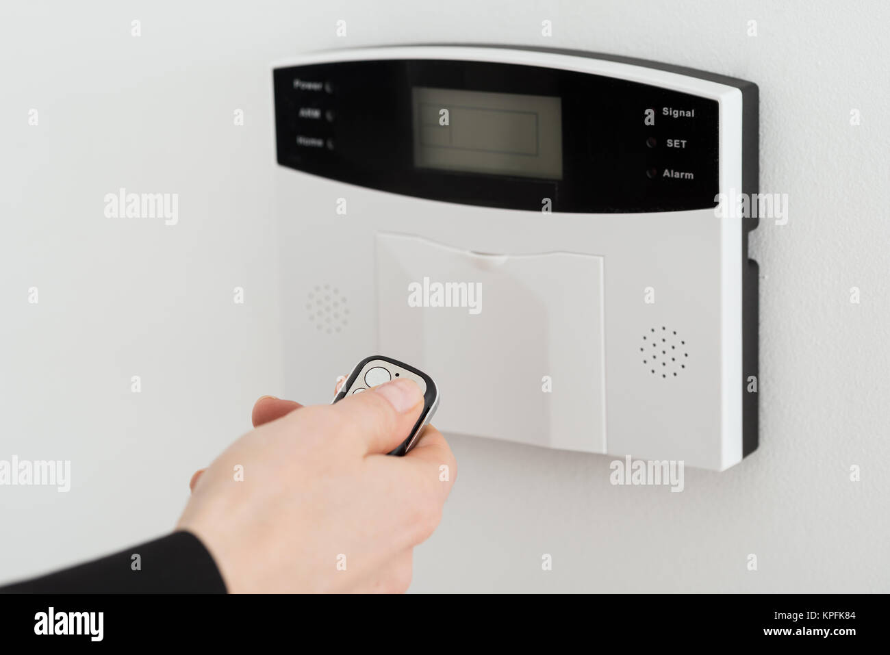 Woman Hand Using Remote To Operate Entrance Security System Stock Photo ...