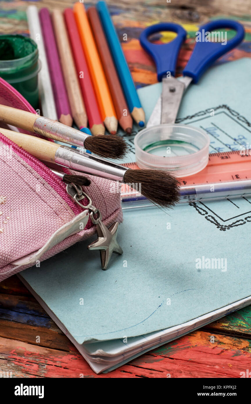 Pen and notebook tool a first grader to school Stock Photo - Alamy